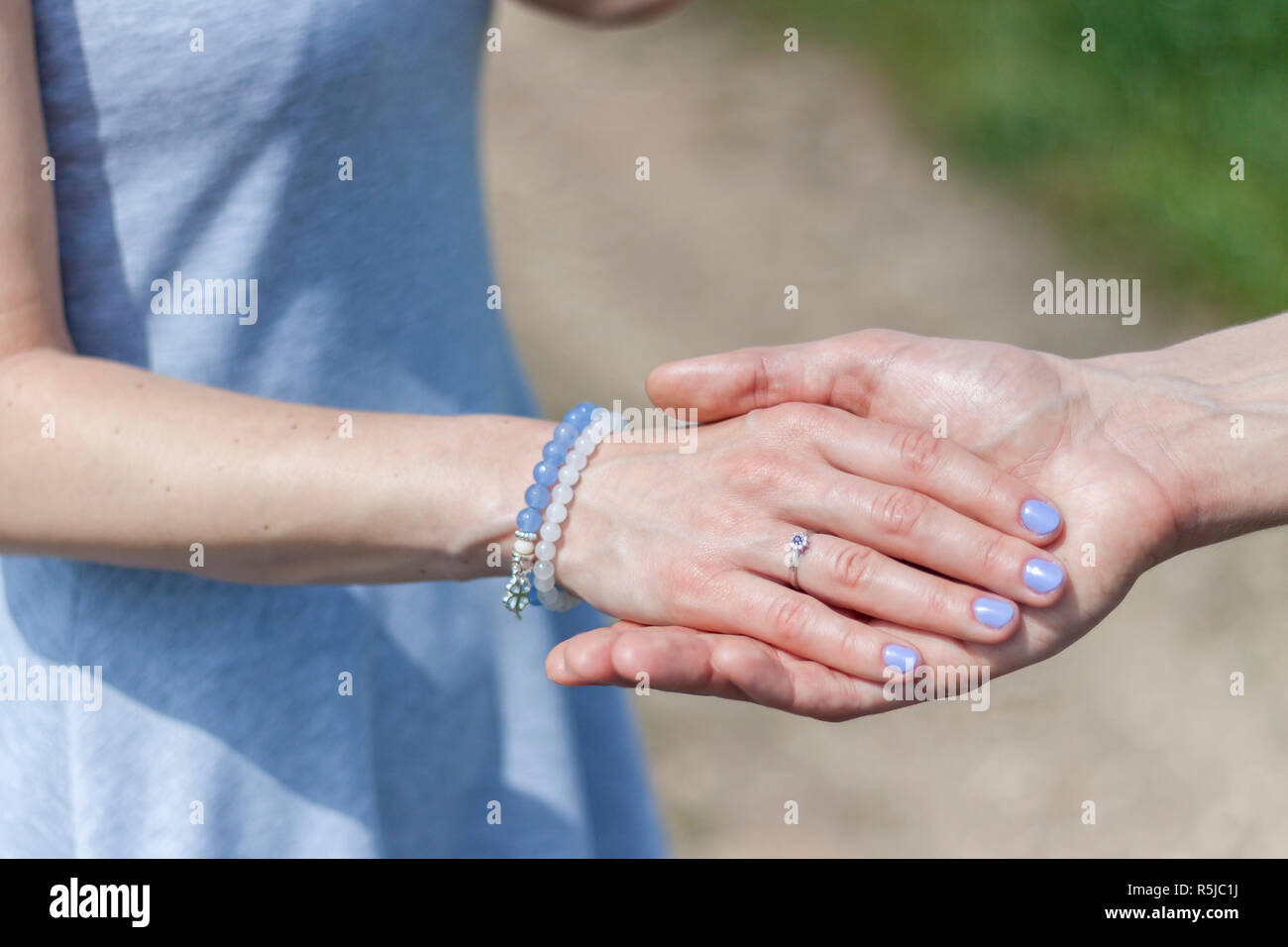 Close-up Holding Hands Stock Photo - Alamy