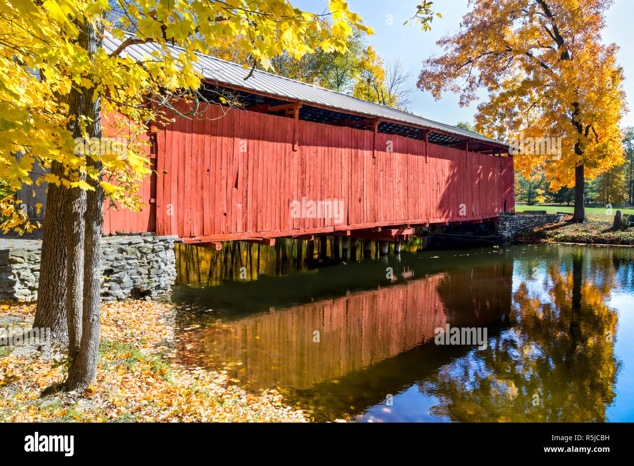Irishman's Covered Bridge is surrounded by colorful autumn foliage at ...