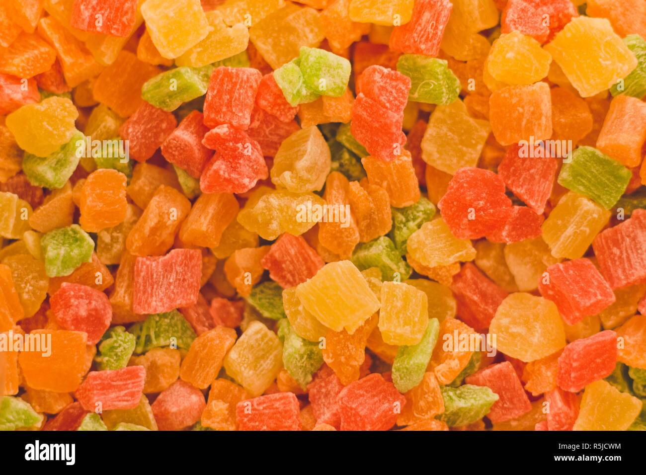 Colorful dried fruits of fruits and berries are cut into pieces in the ...