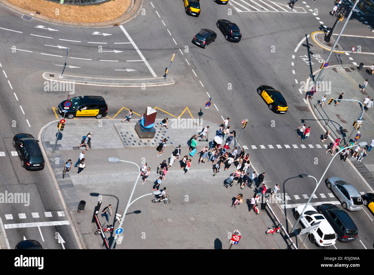 A busy street scene with moving traffic and pedestrians at a major ...