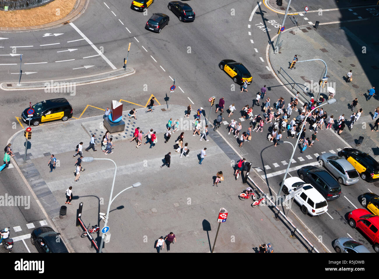 A busy street scene with moving traffic and pedestrians at a major ...
