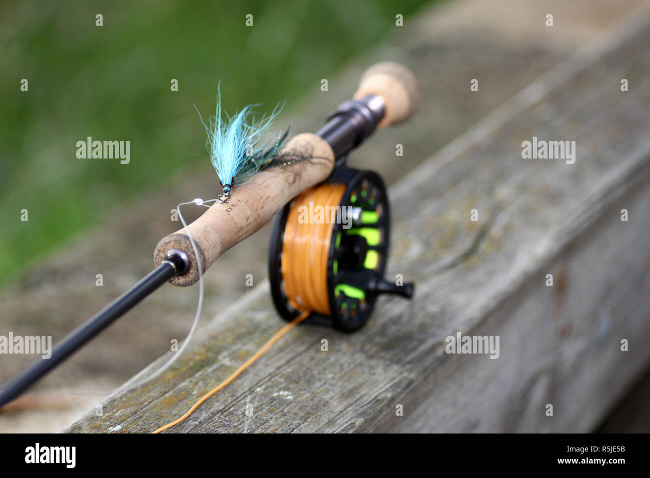 fly fishing rod with roll Stock Photo - Alamy