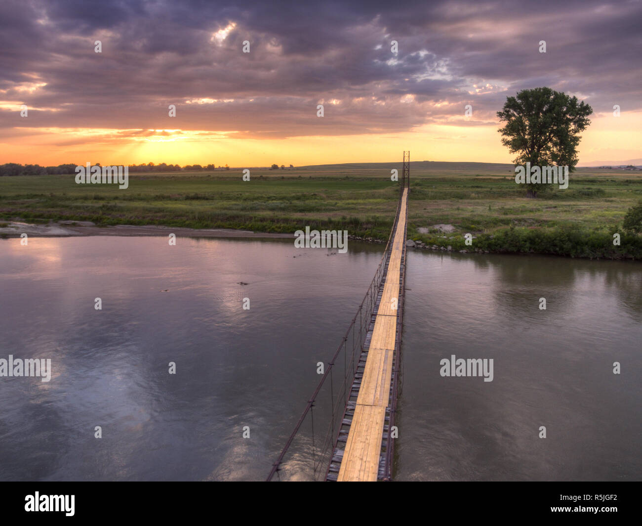 Aerial view of an old suspension bridge at dawn Stock Photo - Alamy
