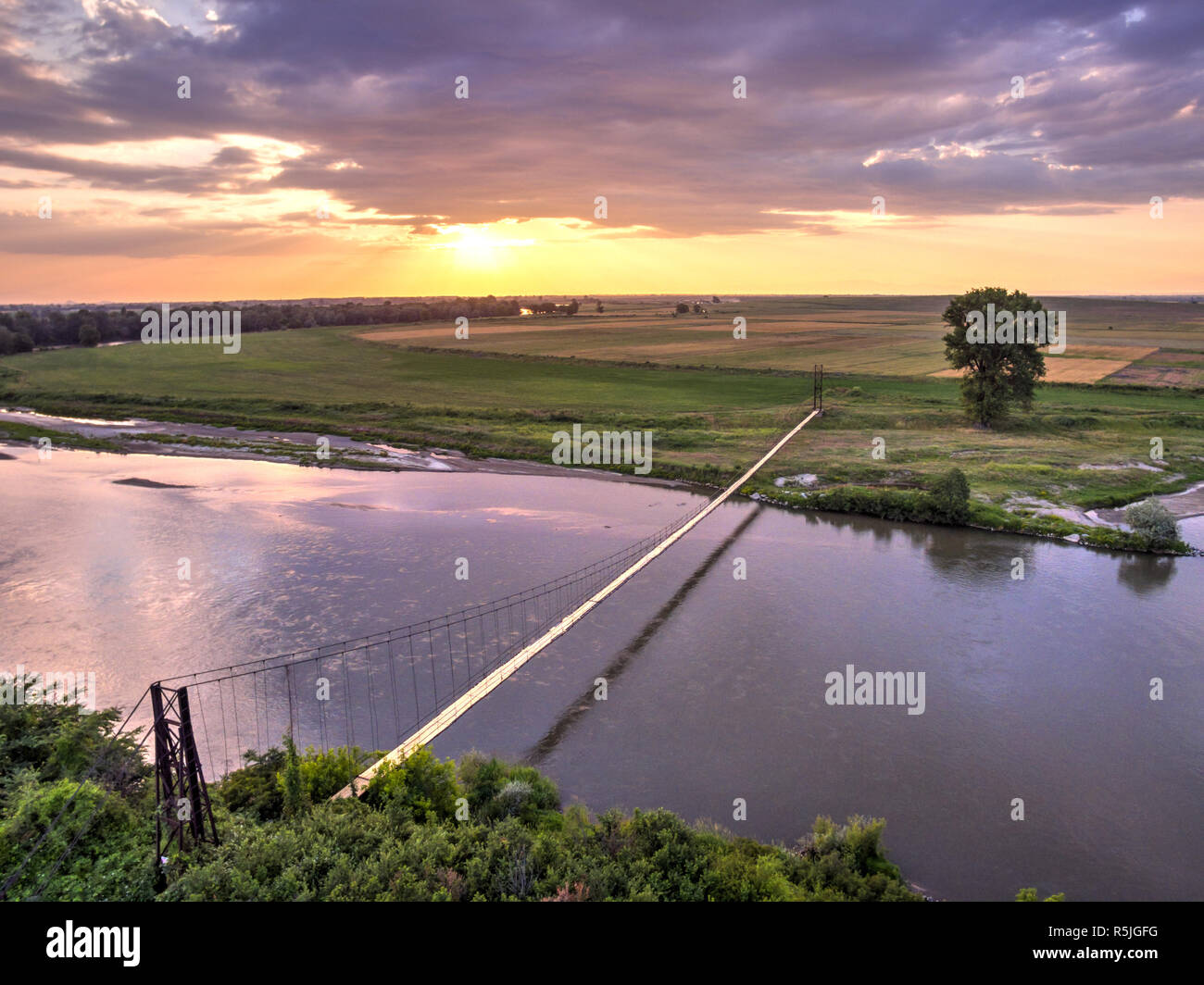 Aerial view of an old suspension bridge at dawn Stock Photo - Alamy