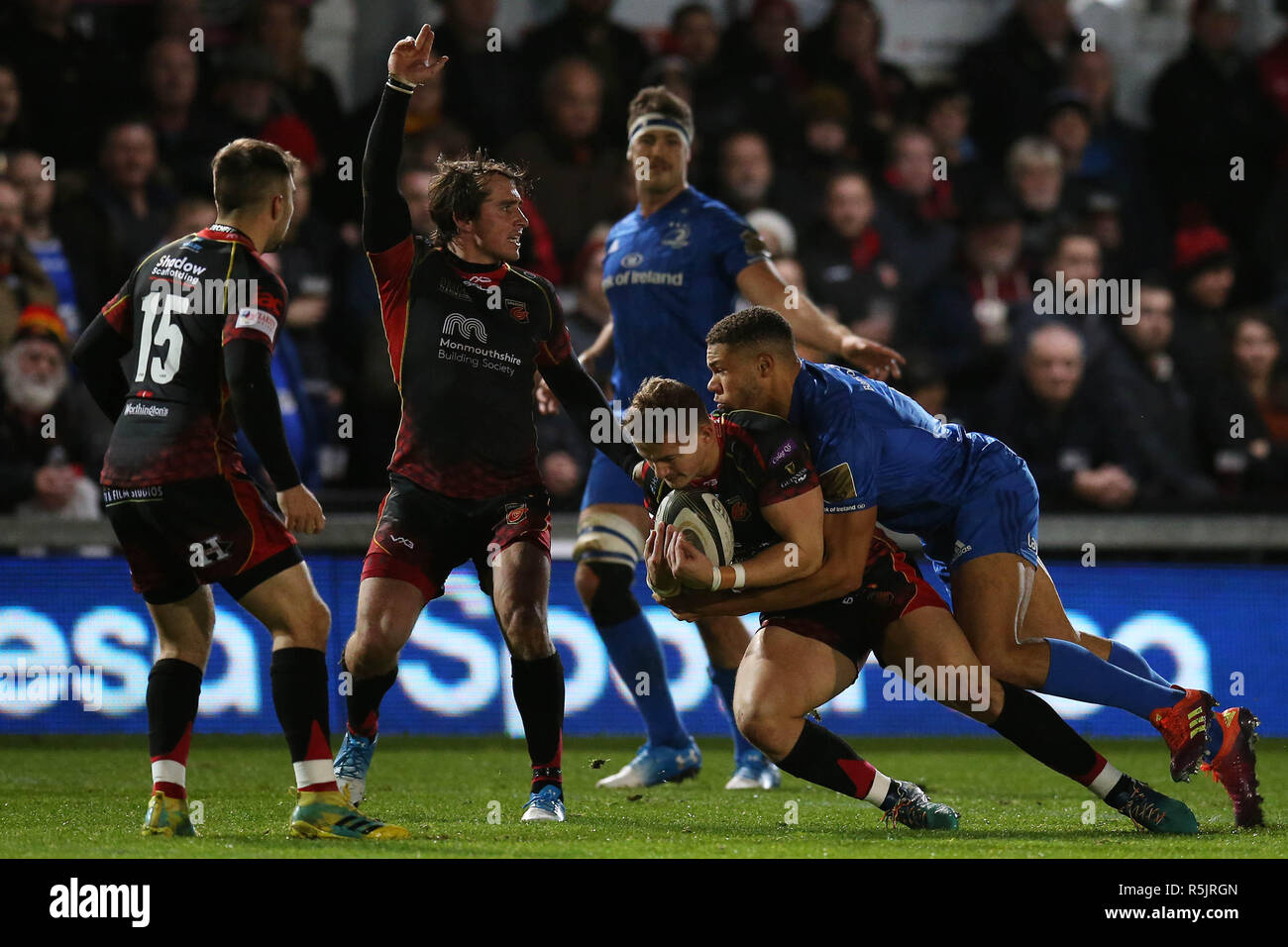 Newport, Wales, UK. 1st December, 2018. Adam Byrne of Leinster tackles ...