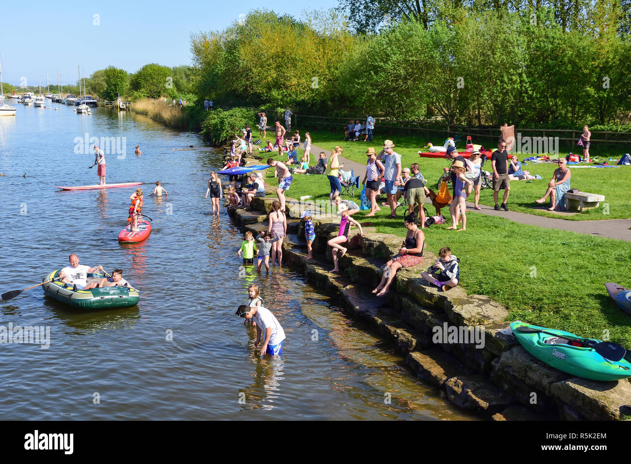 Families relaxing by Frome River, Wareham Quay, Wareham, Dorset ...