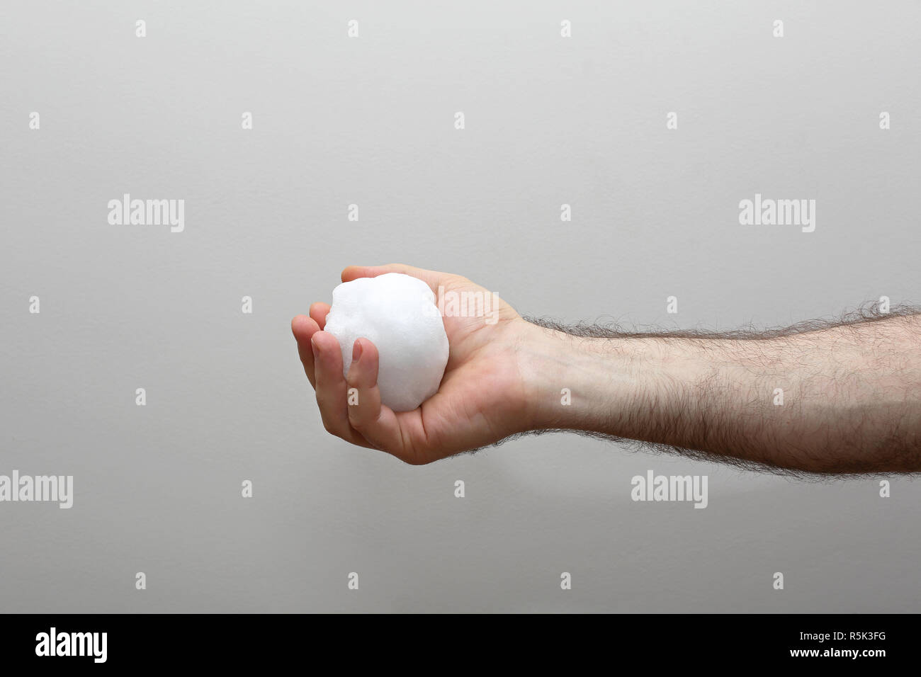 Snowball in Hand Stock Photo - Alamy