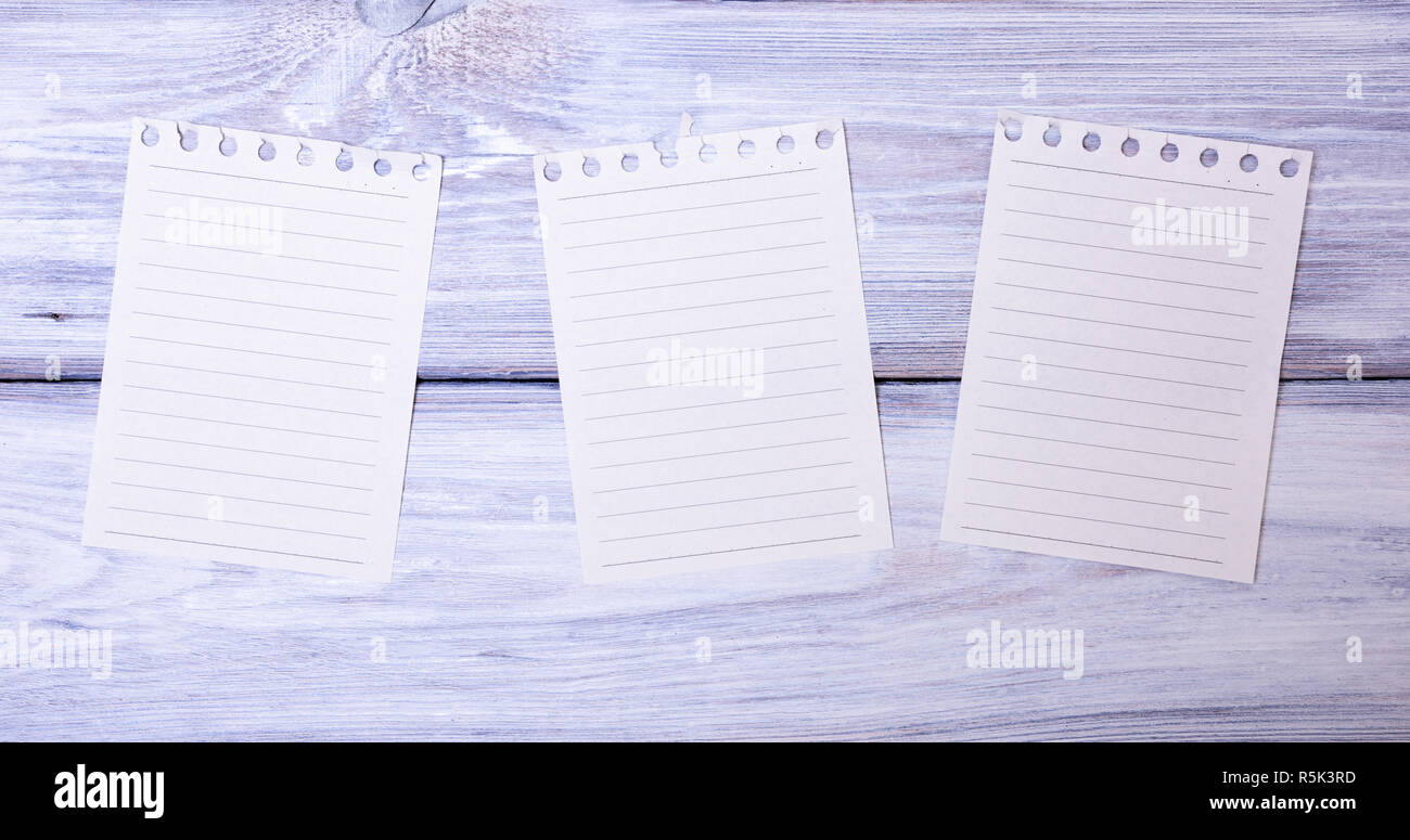 Three blank paper sheets in a line Stock Photo - Alamy