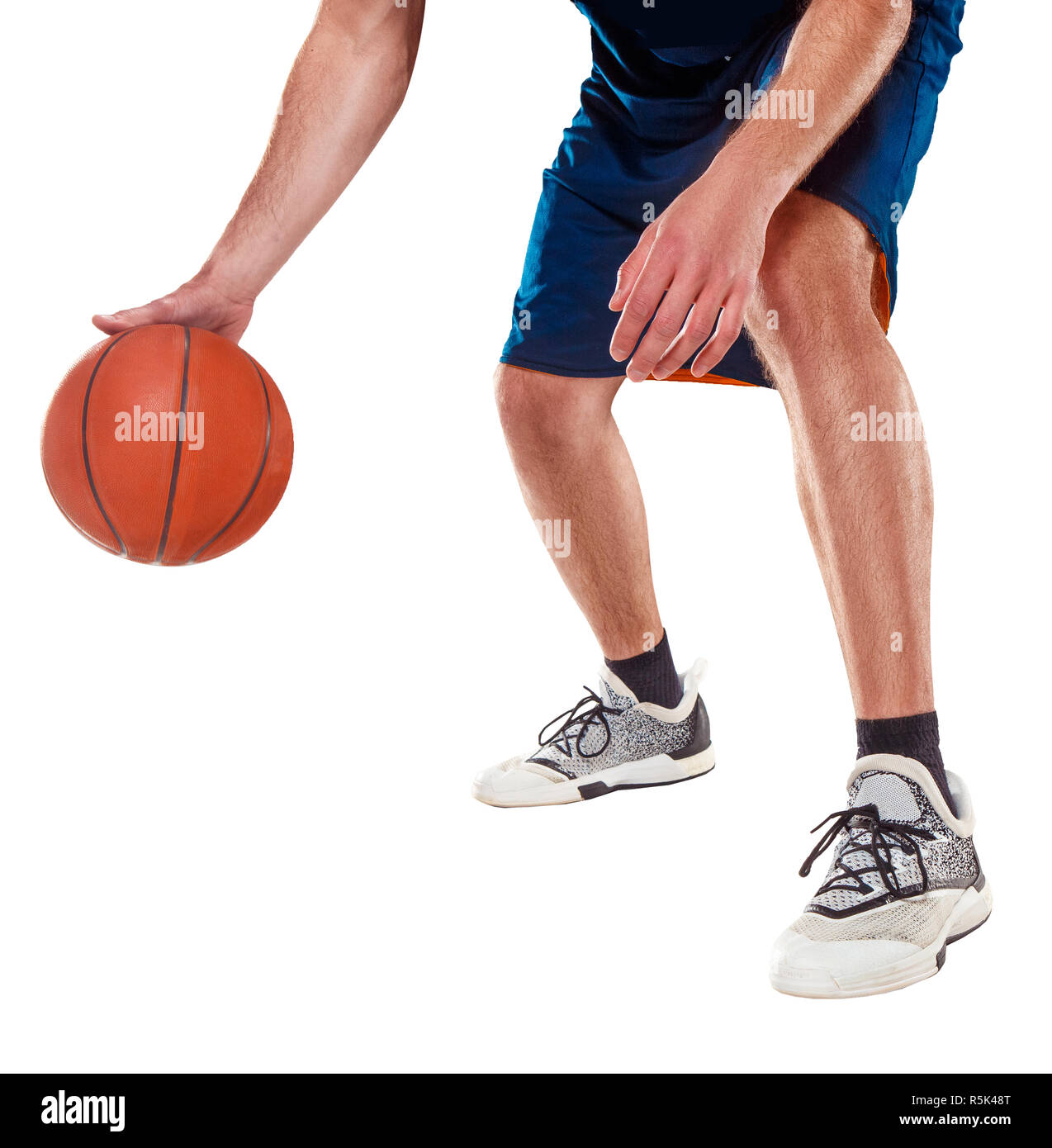 The legs of a basketball player with ball Stock Photo - Alamy