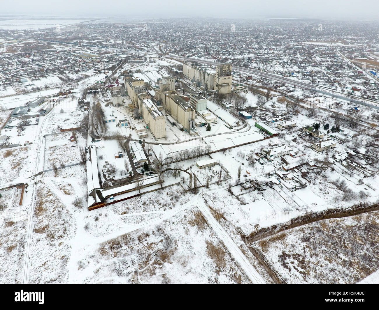 Sprinkled with snow grain elevator. Winter view of the old Soviet ...