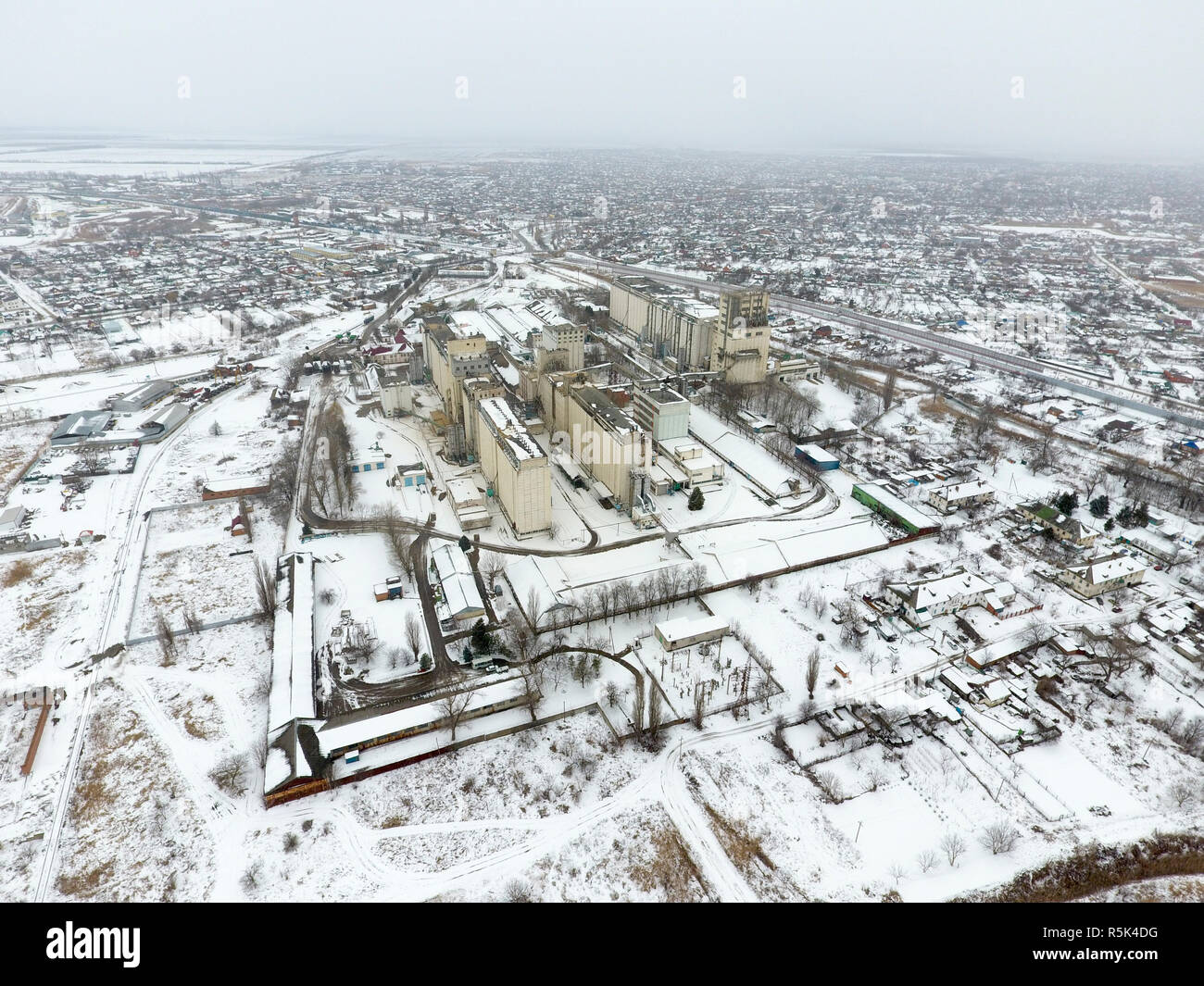 Sprinkled with snow grain elevator. Winter view of the old Soviet ...