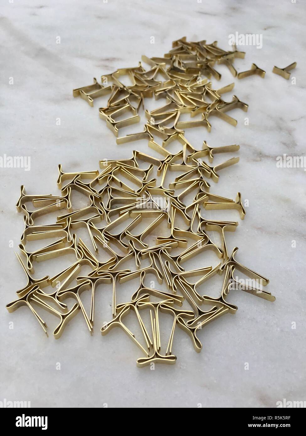 flat head clamps made of brass for consignments Stock Photo - Alamy