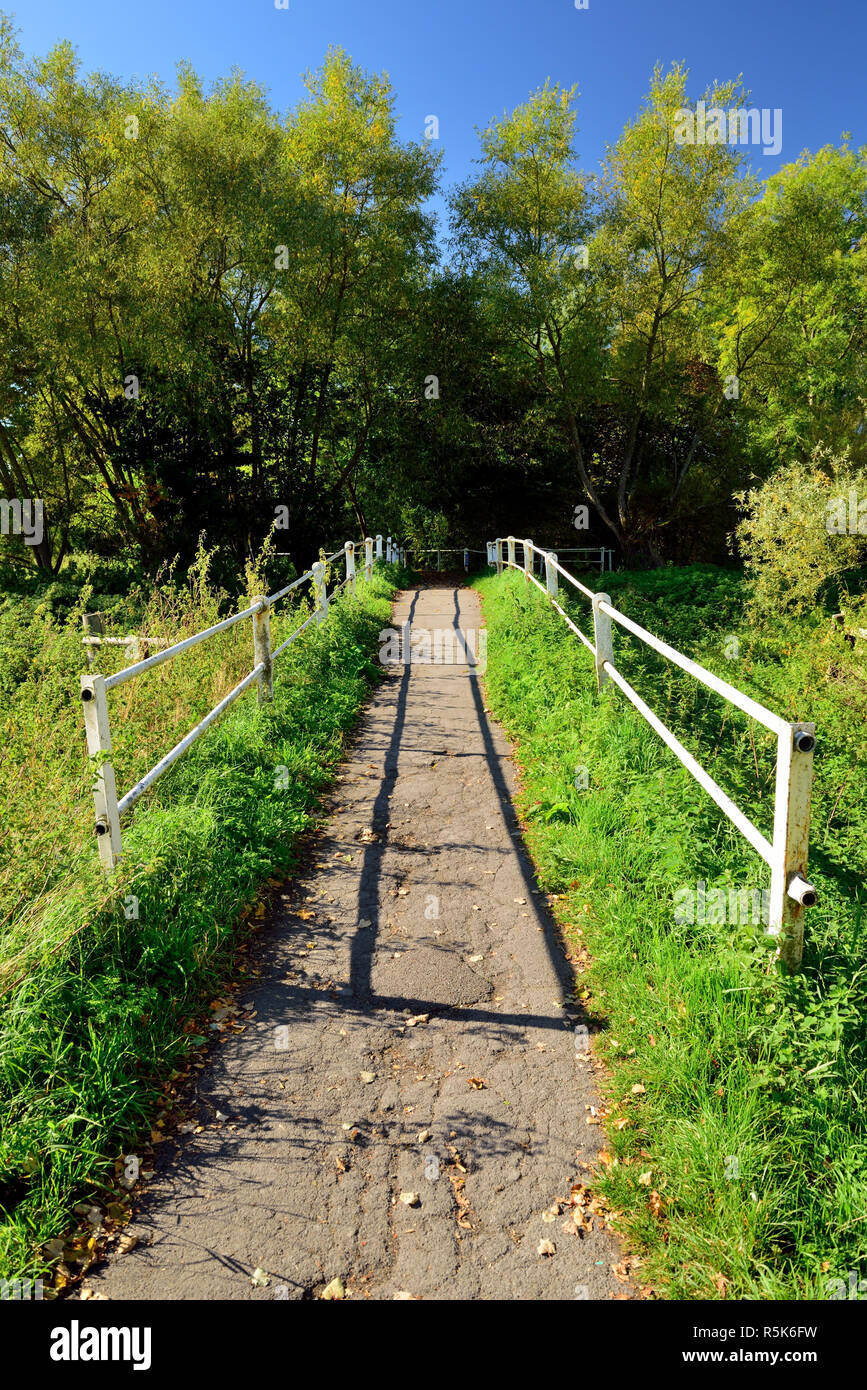 Tarmac path over the infant river Kennet at Avebury, part of the route ...