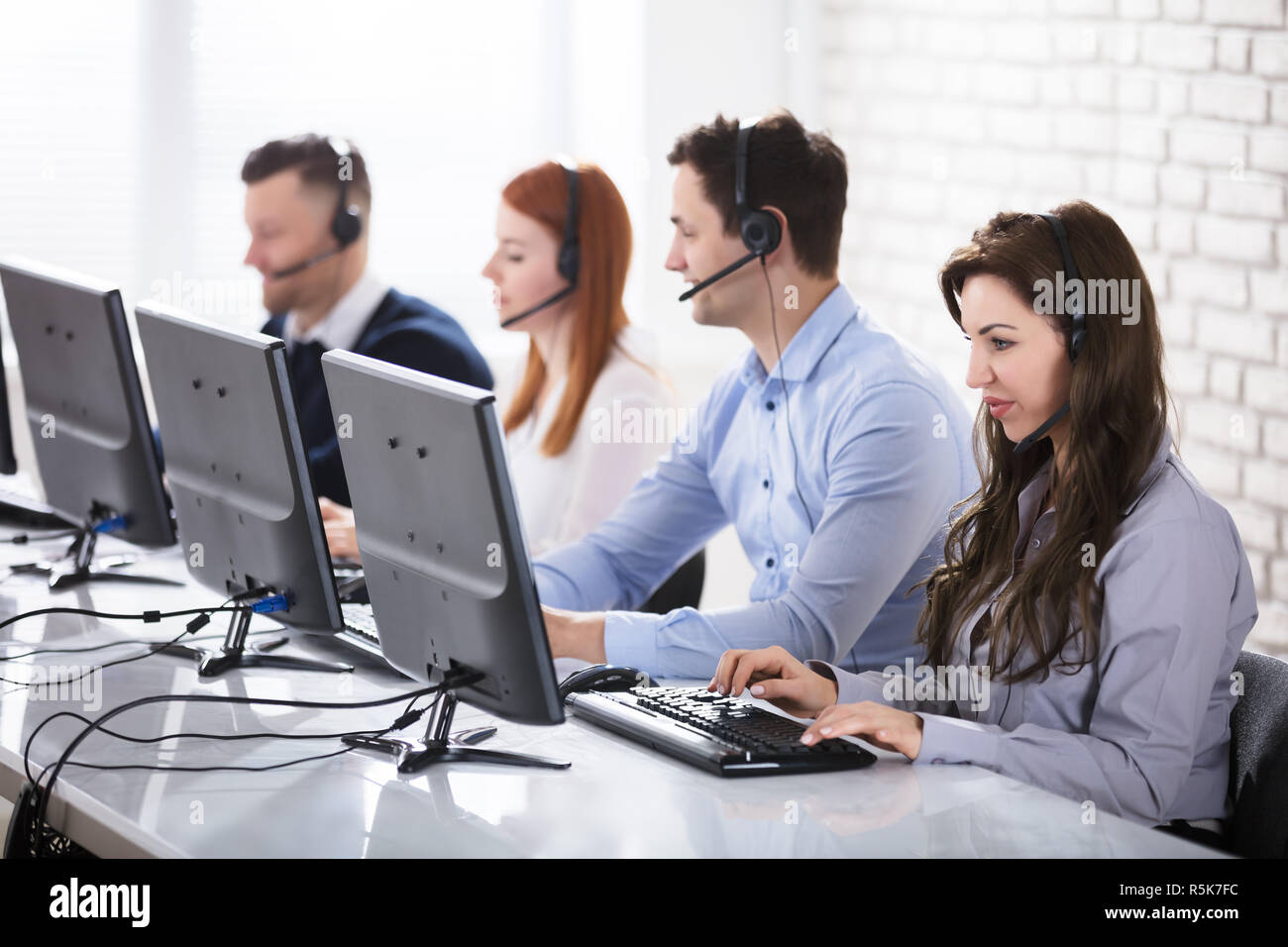 Call Center Team In Office Stock Photo - Alamy