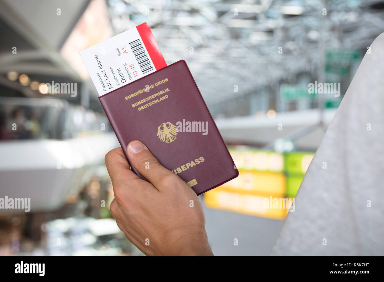Hand Holding Passport And Boarding Pass Stock Photo - Alamy