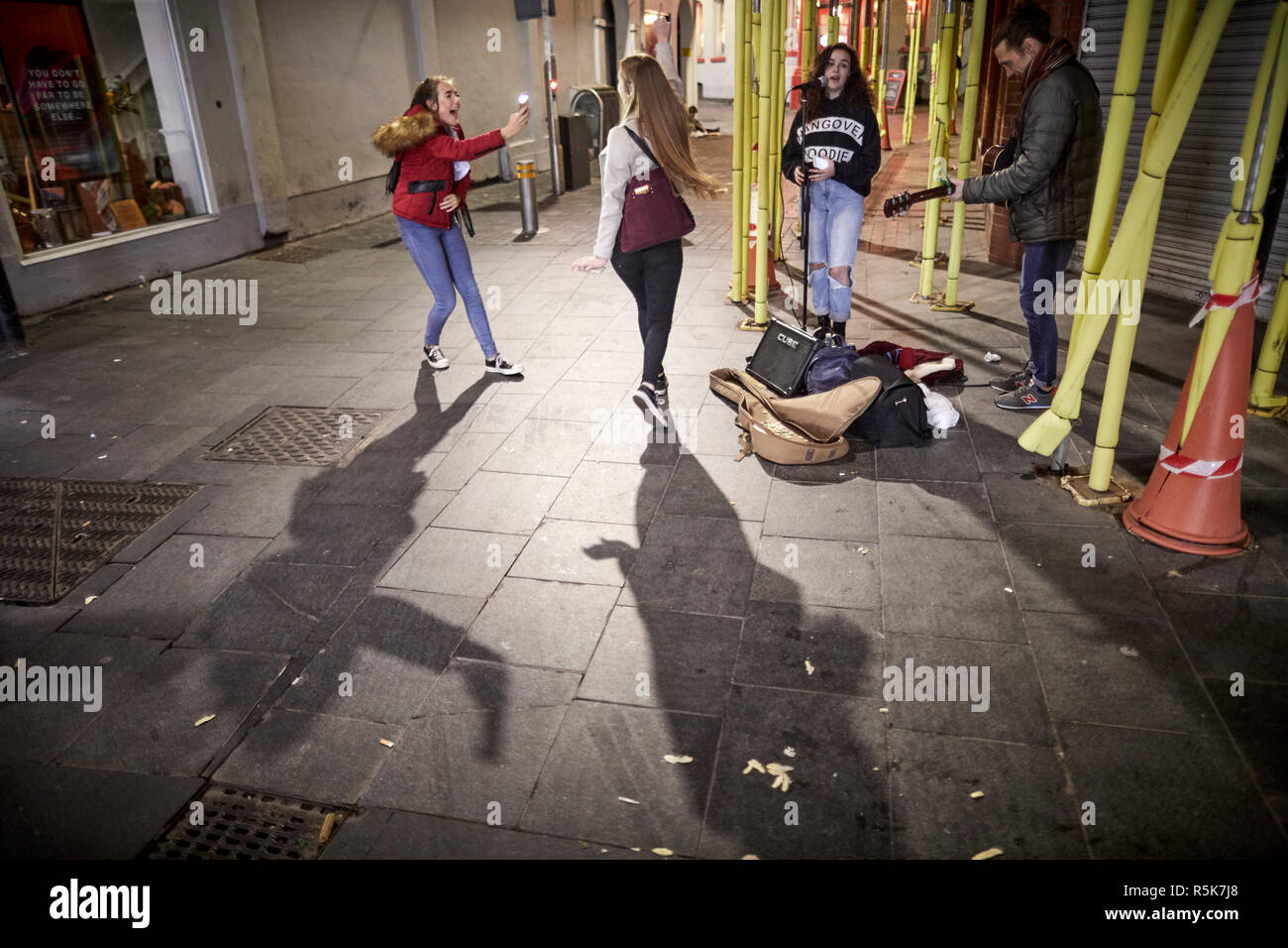 Liverpool city centre young girls dance with buskers Stock Photo - Alamy