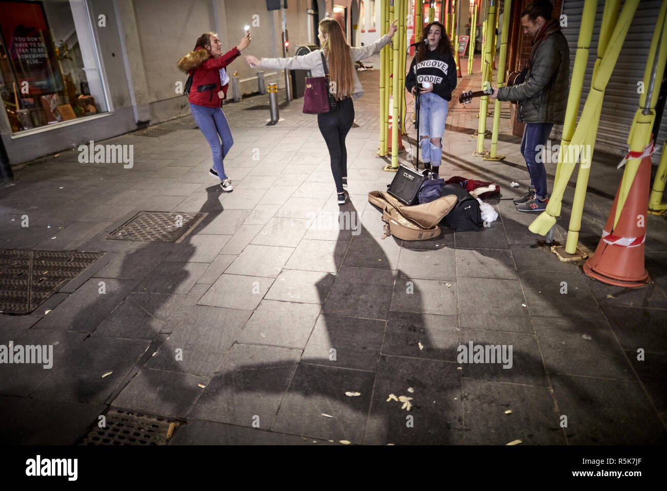 Liverpool city centre young girls dance with buskers Stock Photo - Alamy