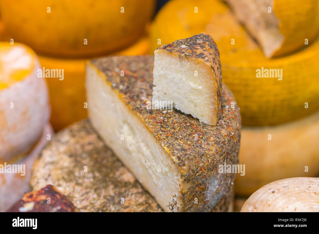 Craft cheese. Cheese head. Artisan cheese Stock Photo - Alamy