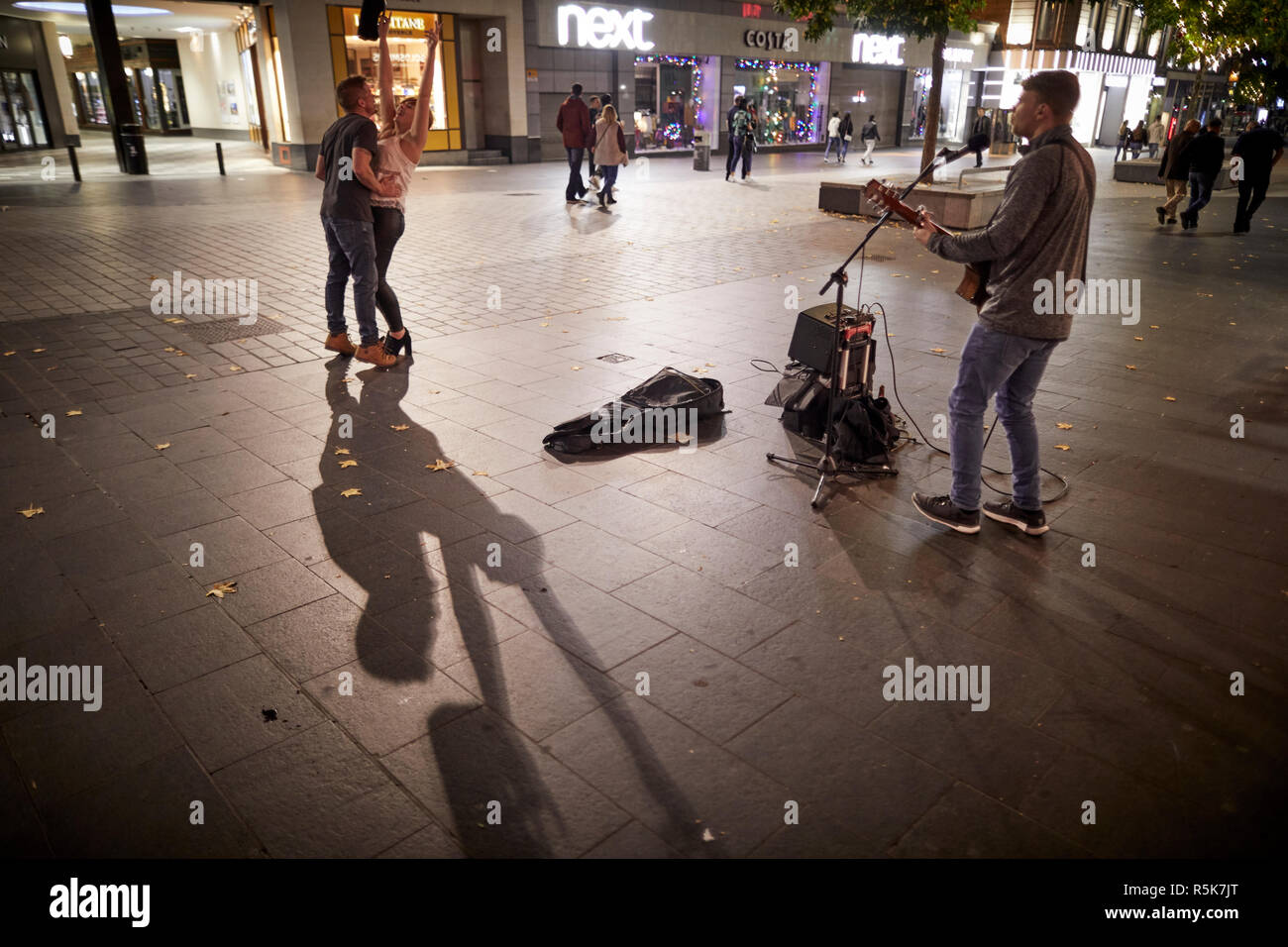 Liverpool city centre young couple dance with buskers Stock Photo - Alamy