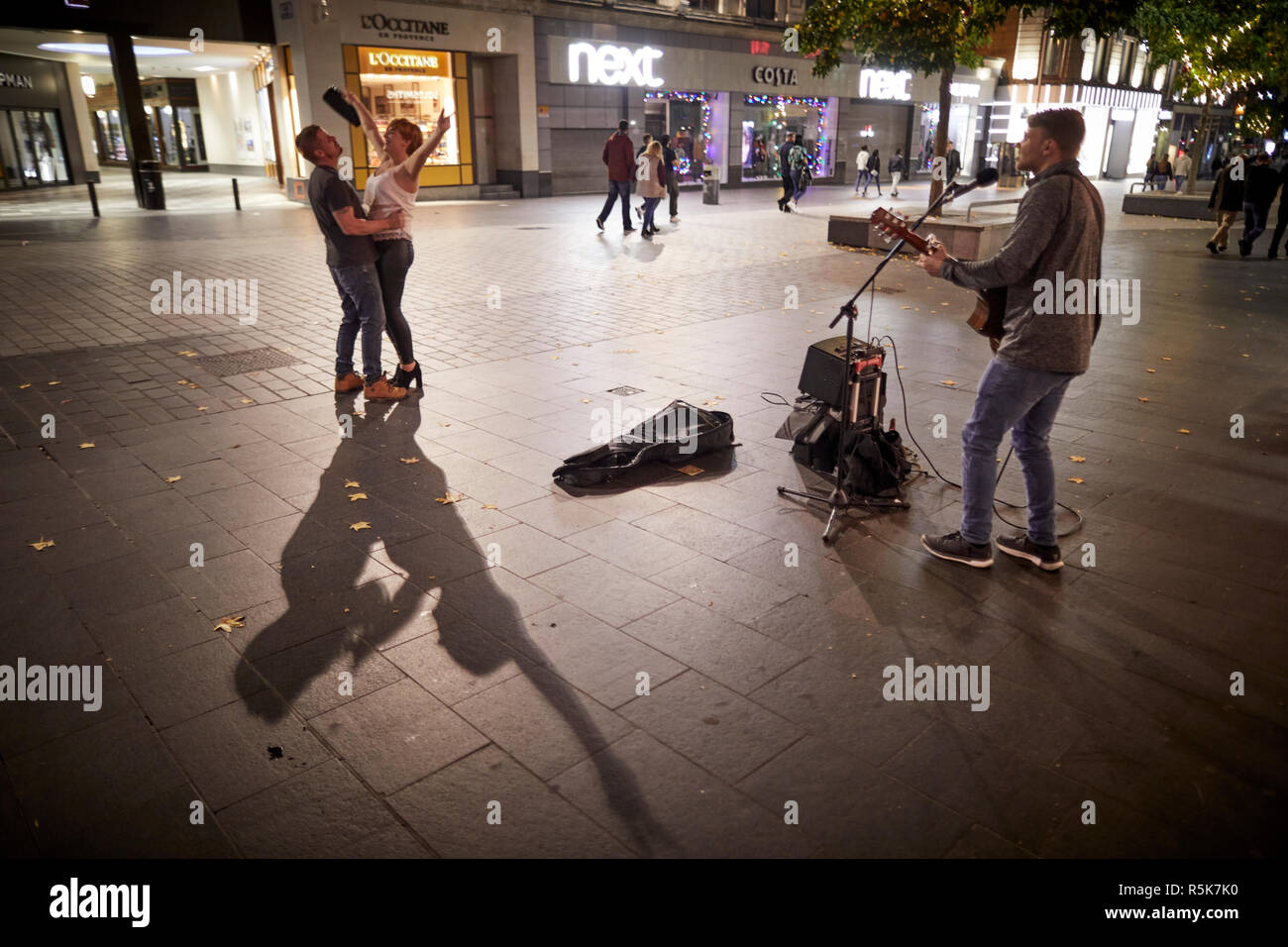 Liverpool city centre young couple dance with buskers Stock Photo - Alamy