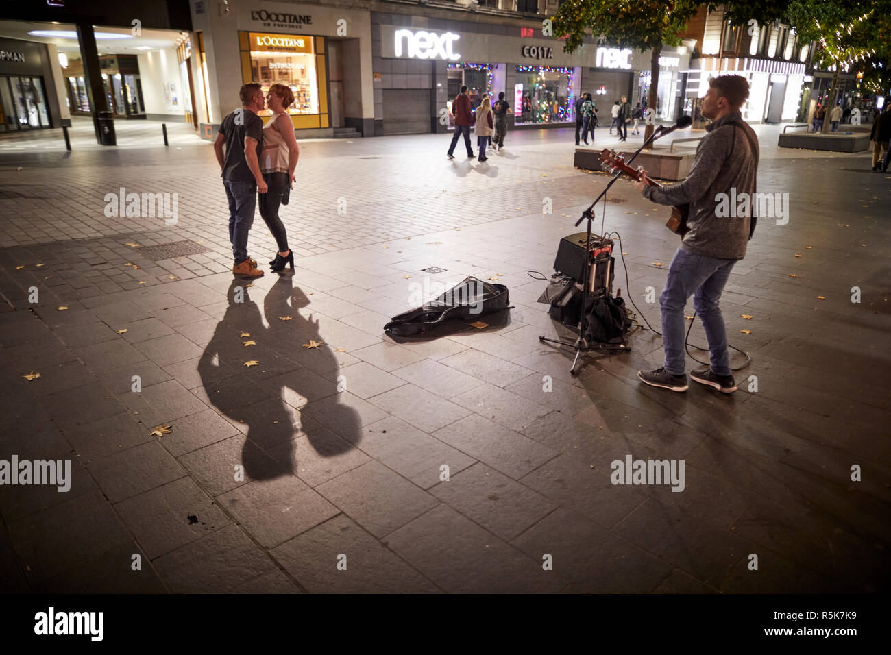 Liverpool city centre young couple dance with buskers Stock Photo - Alamy
