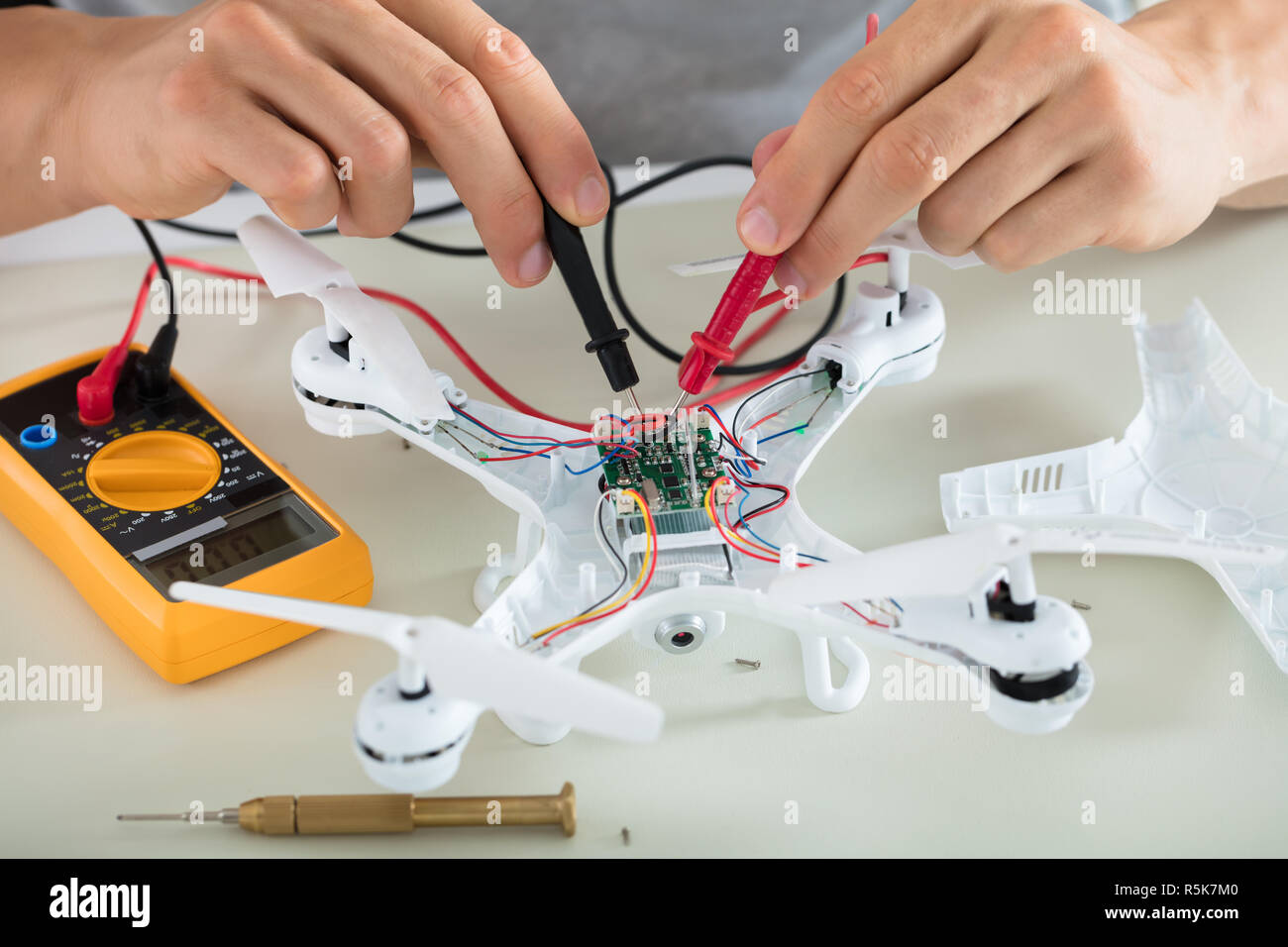 Man Testing Electric Current Of Drone Using Multimeter Tool Stock Photo ...