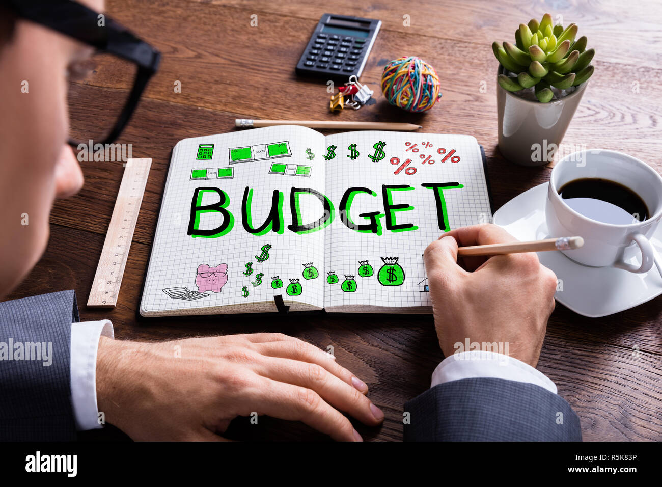 Man Drawing Budget Plan Stock Photo - Alamy