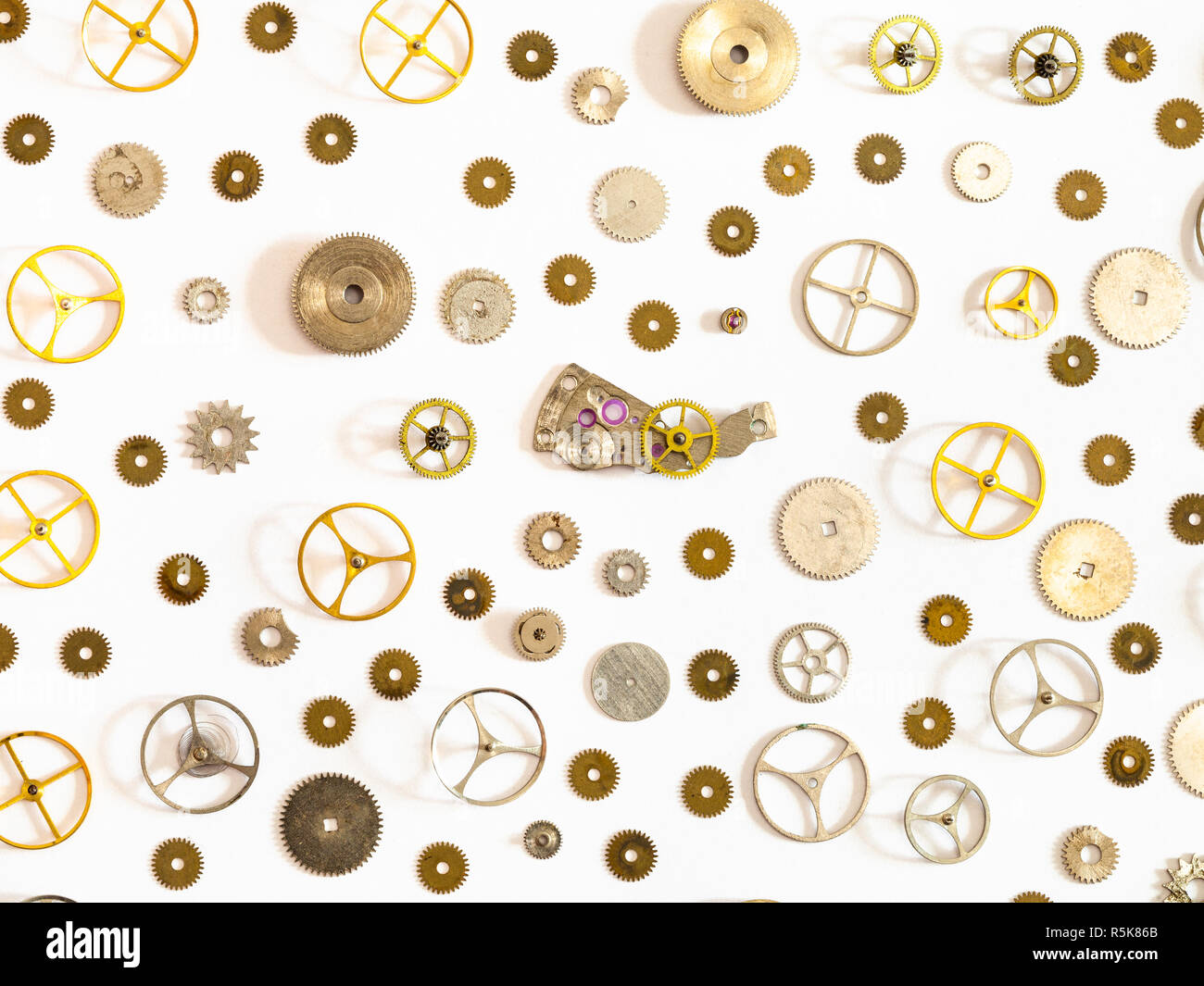 pattern from various used watch spare parts Stock Photo - Alamy