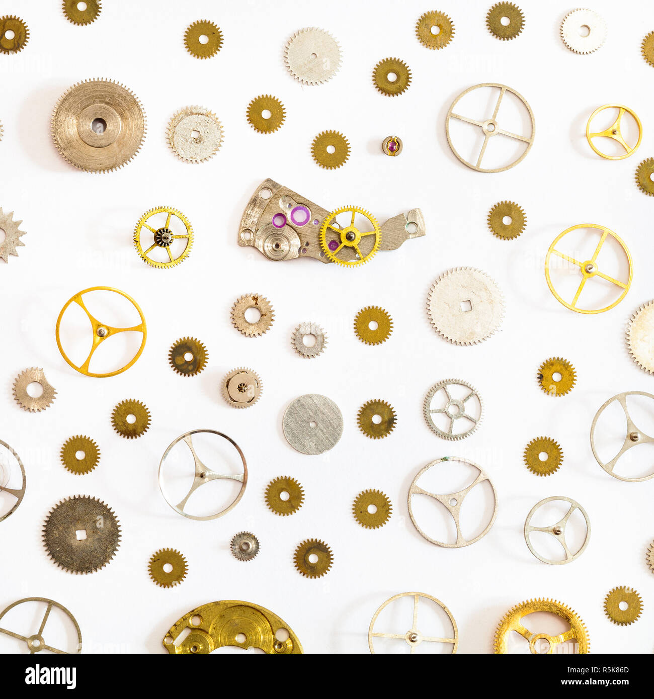 pattern from various old watch spare parts Stock Photo - Alamy