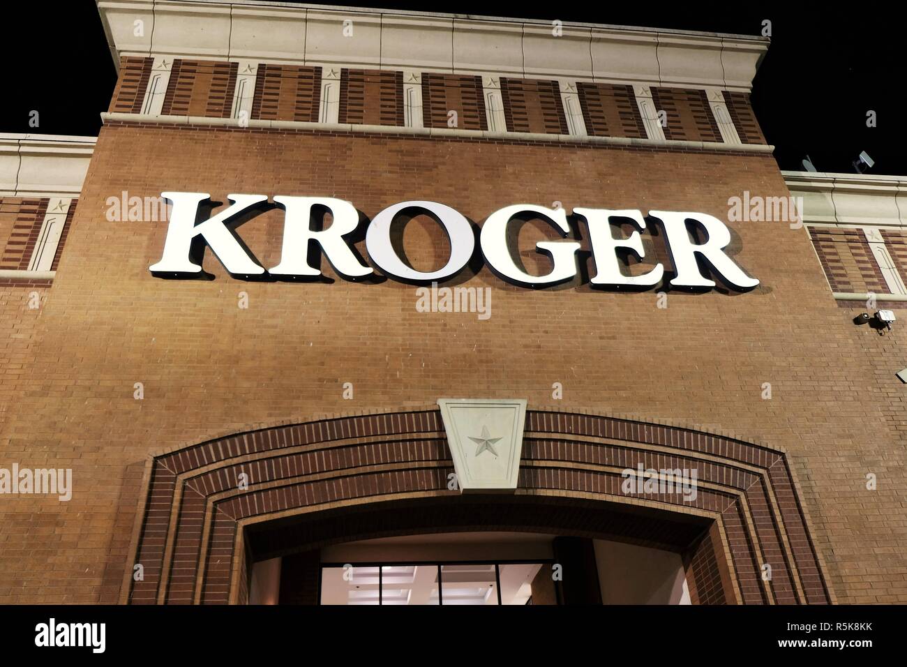 Kroger grocery store at night; Kroger sign on wall in front of store ...