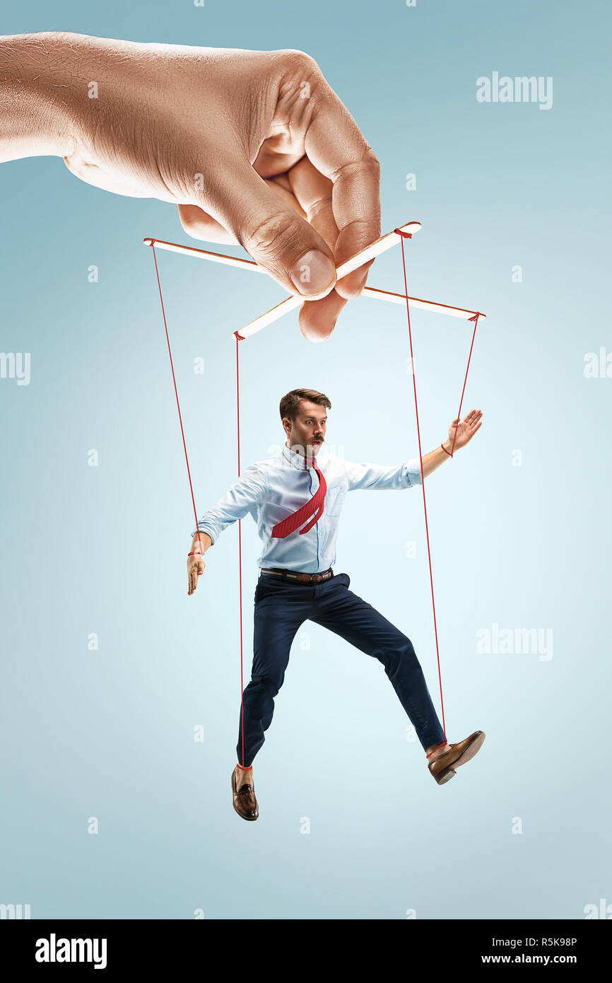 Human puppet hi-res stock photography and images - Alamy