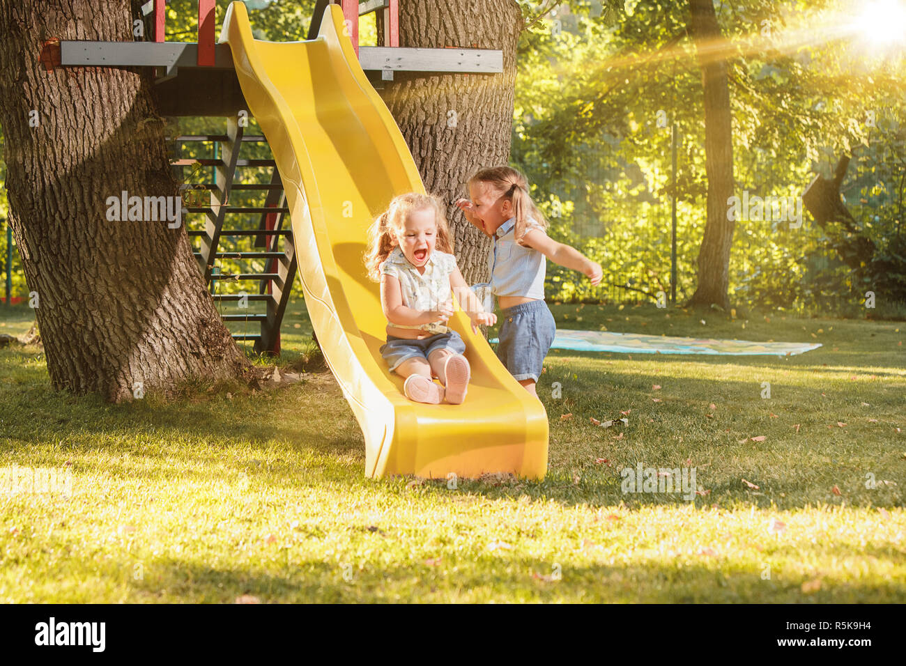 Girl rolling down hill hi-res stock photography and images - Alamy