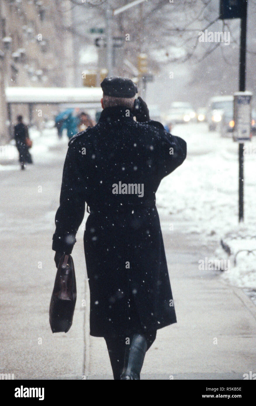 Businessman walking in snow hi-res stock photography and images - Alamy