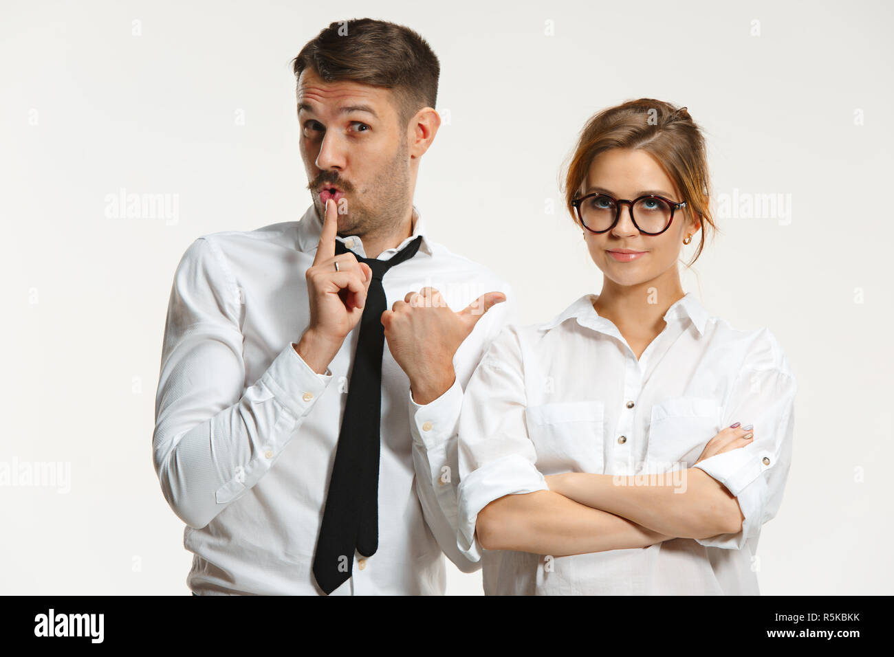 The business man and woman communicating on a gray background Stock ...