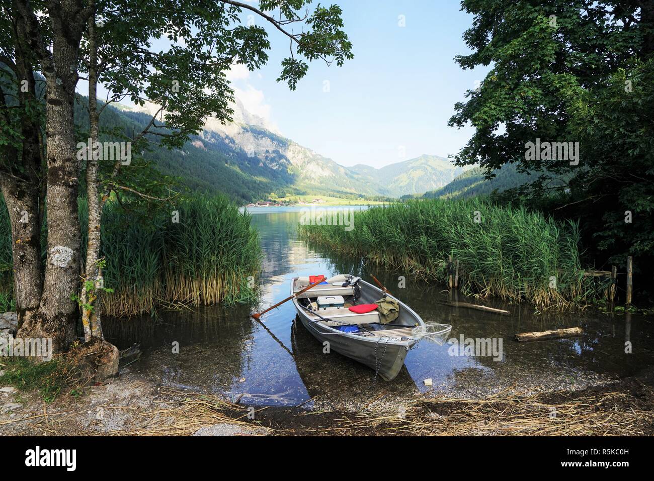 fishing boat on a lake in the tyrolean alps Stock Photo - Alamy
