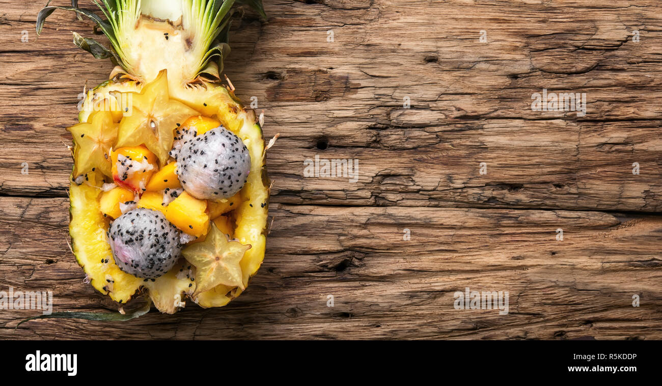 Pineapple stuffed with exotic fruits Stock Photo - Alamy