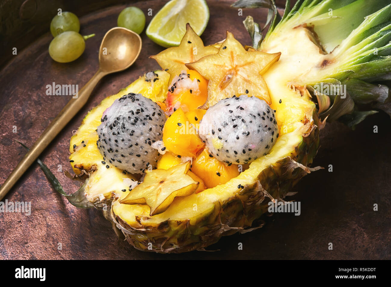 Pineapple stuffed with exotic fruits Stock Photo - Alamy