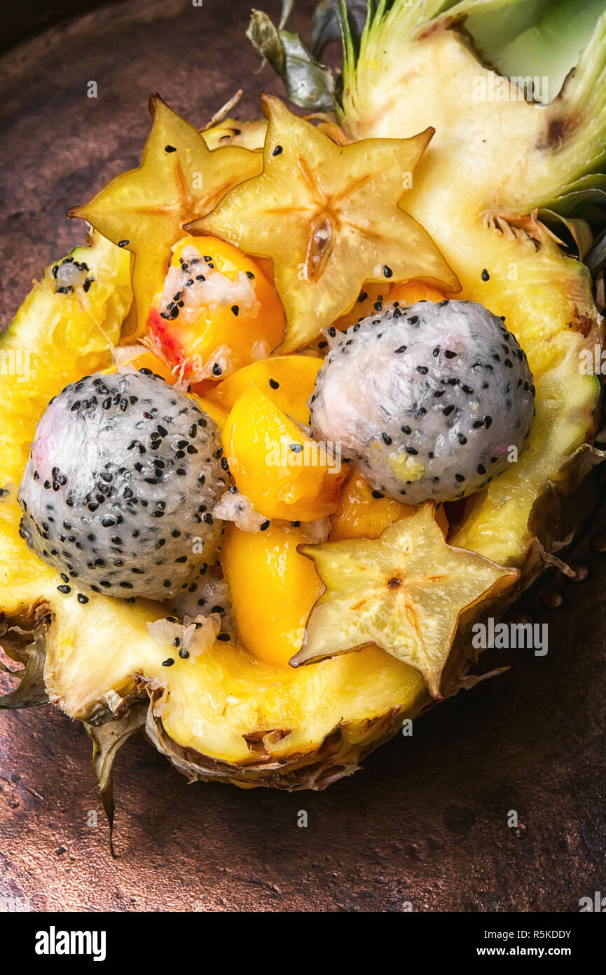 Pineapple stuffed with exotic fruits Stock Photo - Alamy