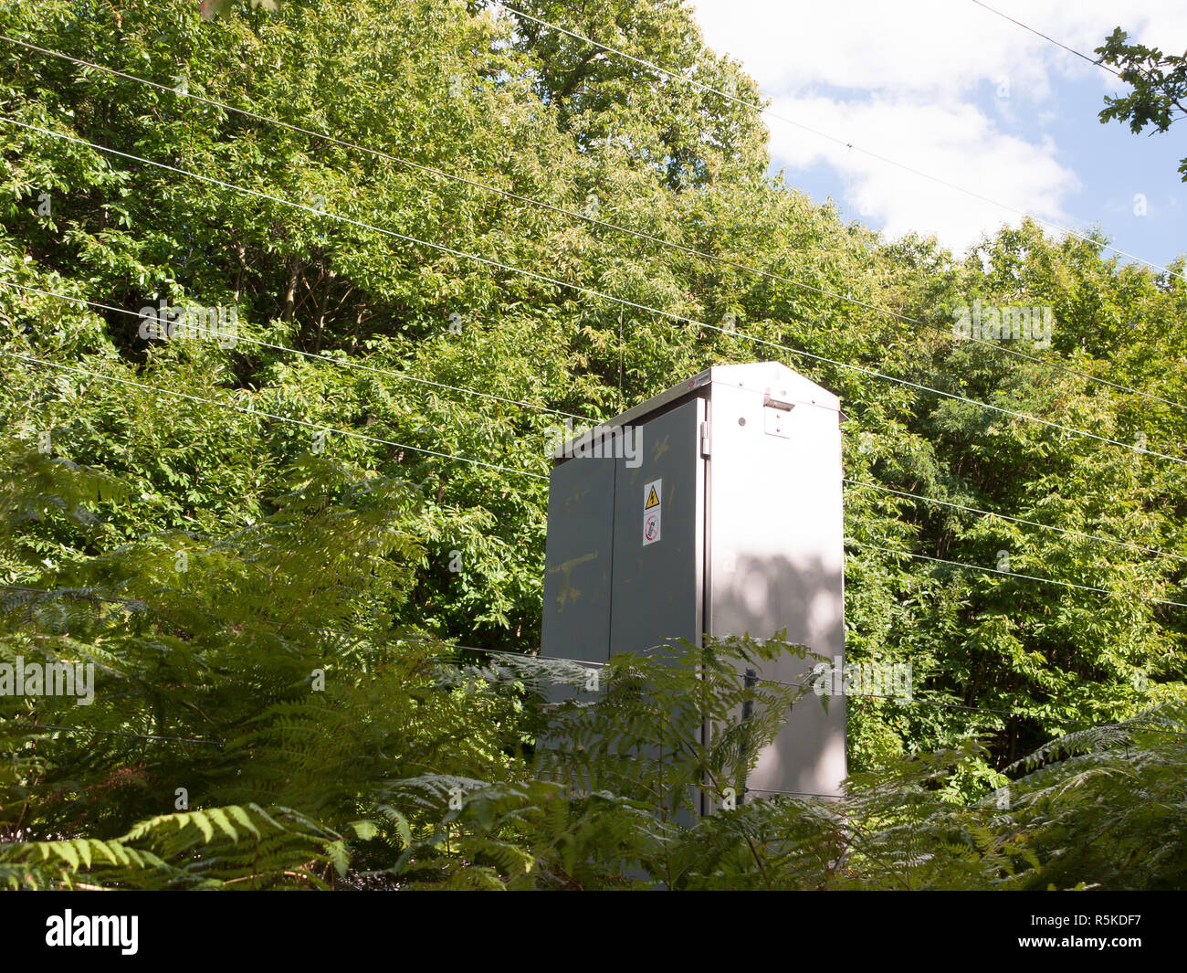 metal box silver sheen electrical power grid on train tracks Stock ...