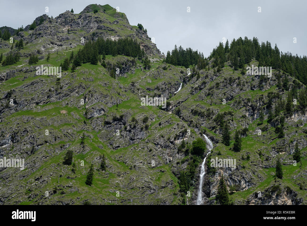 mountain and waterfall in the allgÃ¤u oytal with conifers Stock Photo ...