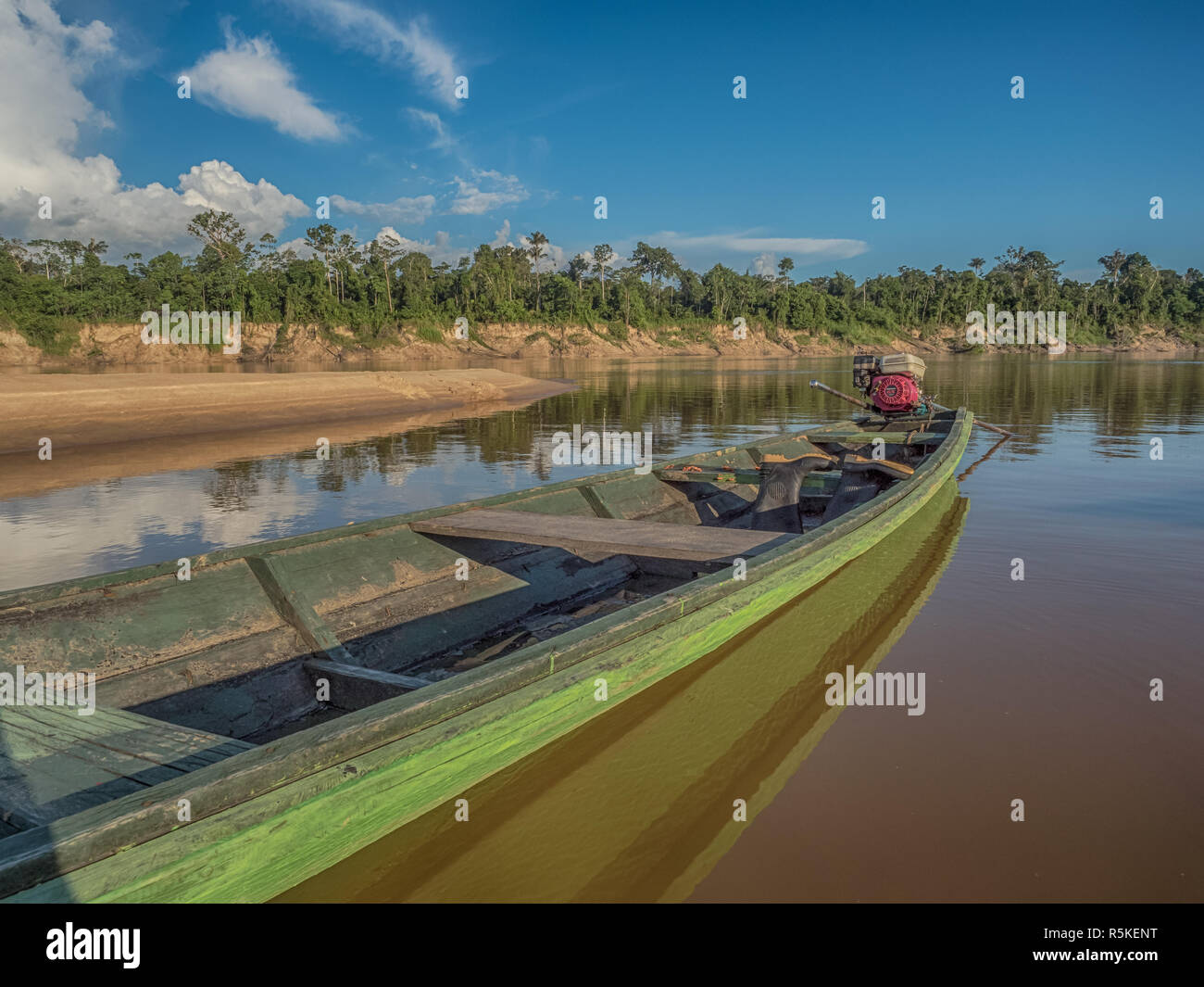 Wooden boats on the sandy beach at the Javari River, the tributary of ...