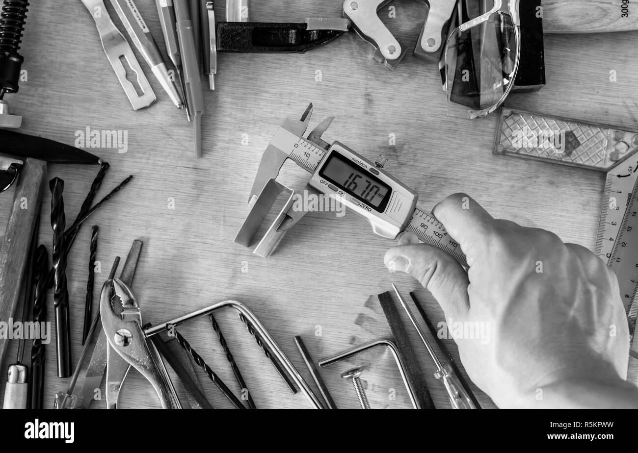 black and white many different tools in mess Stock Photo - Alamy