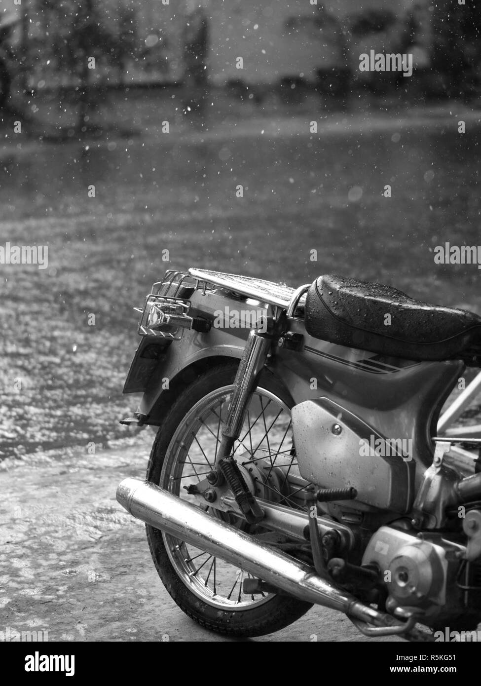 Motorcycle rain Black and White Stock Photos & Images - Alamy
