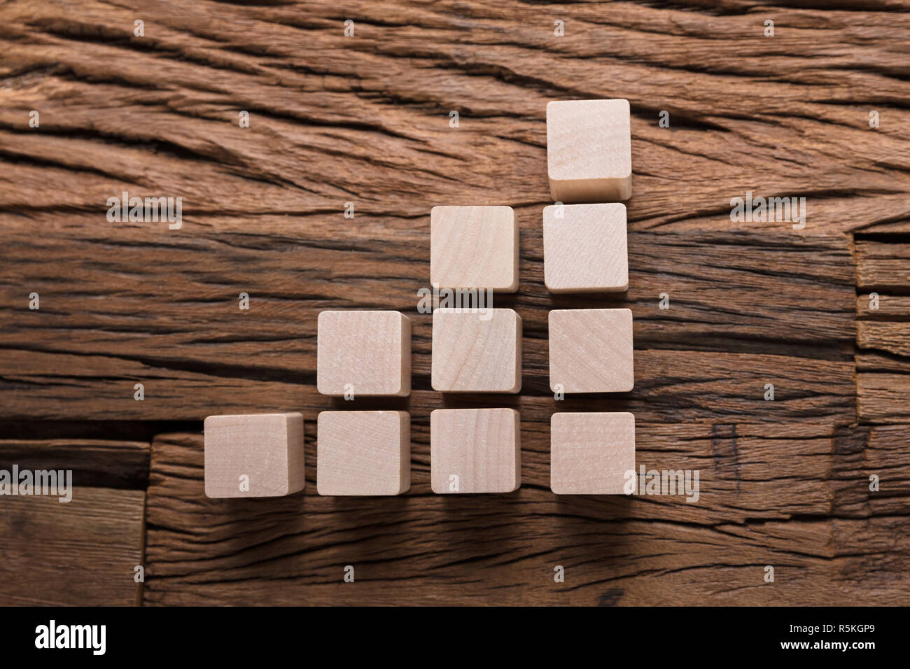Increasing Bar Graph Blocks On Wood Stock Photo - Alamy