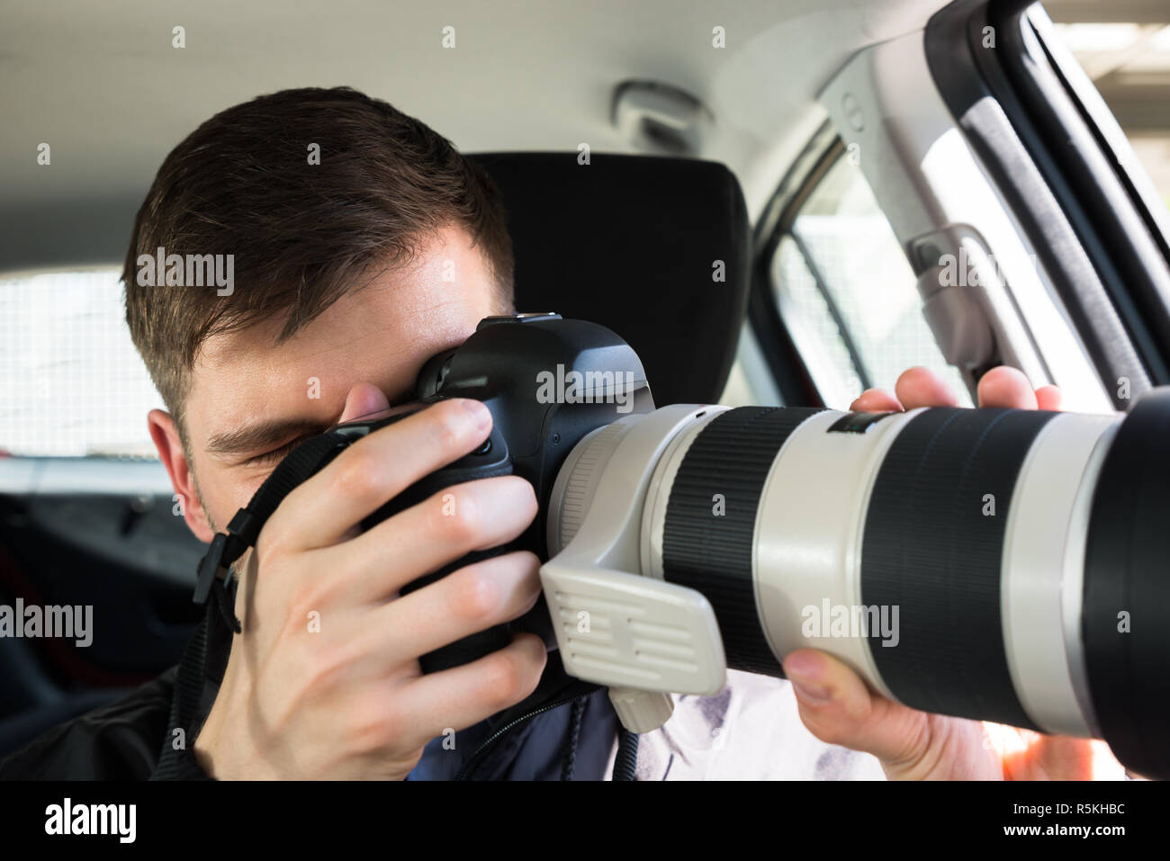 Private Detective Photographing With Slr Camera Stock Photo - Alamy