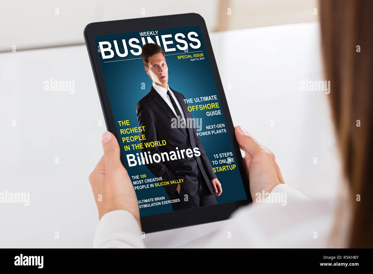 Businessperson Looking At Business Magazine Stock Photo - Alamy