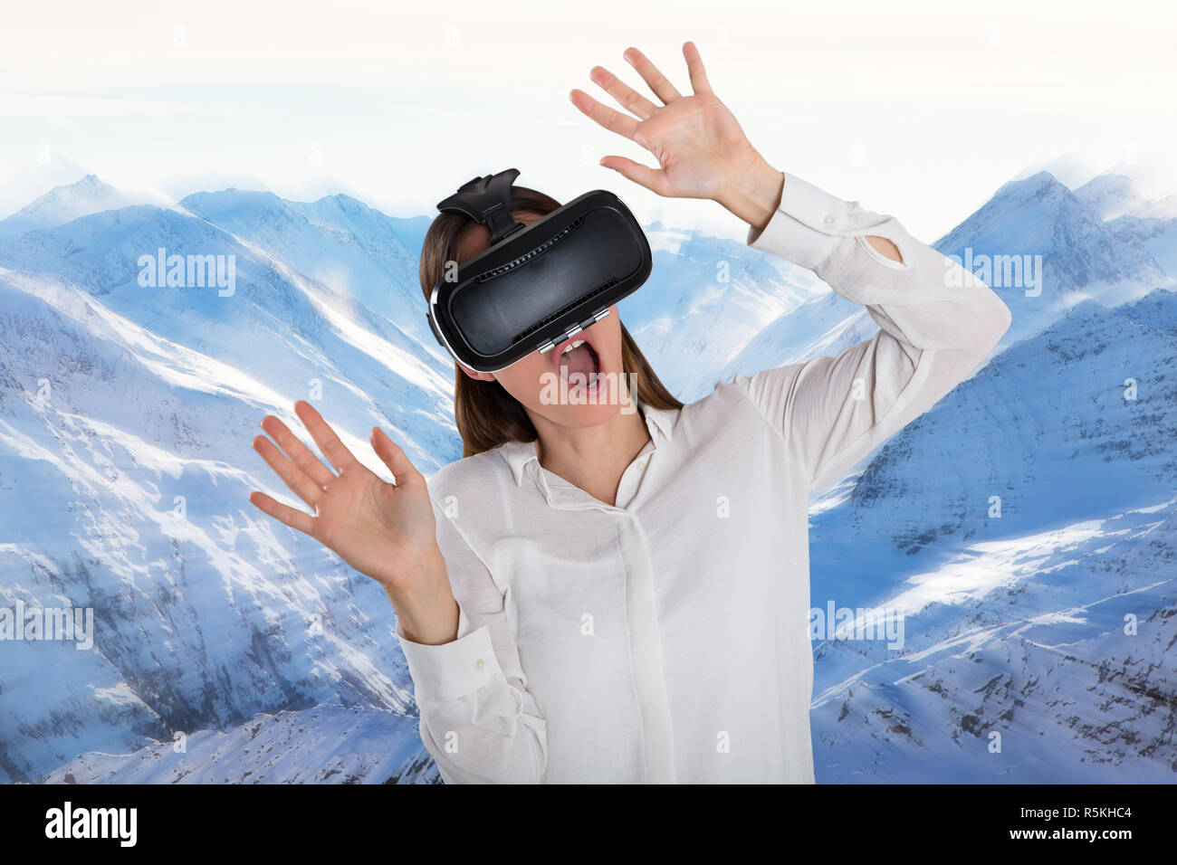 Woman With A Frightened Pose Wearing Virtual Reality Stock Photo - Alamy