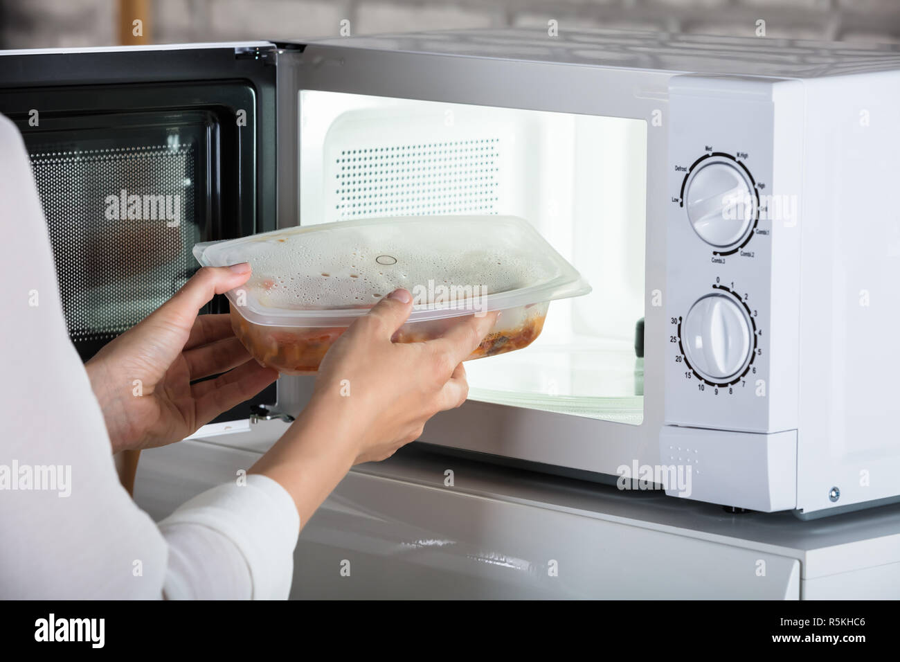 Person Removing Prepared Food Stock Photo - Alamy