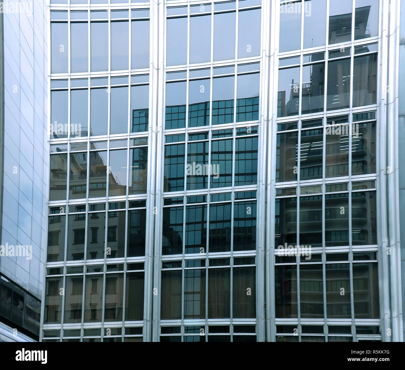 Reflection glass facade building Stock Photo - Alamy