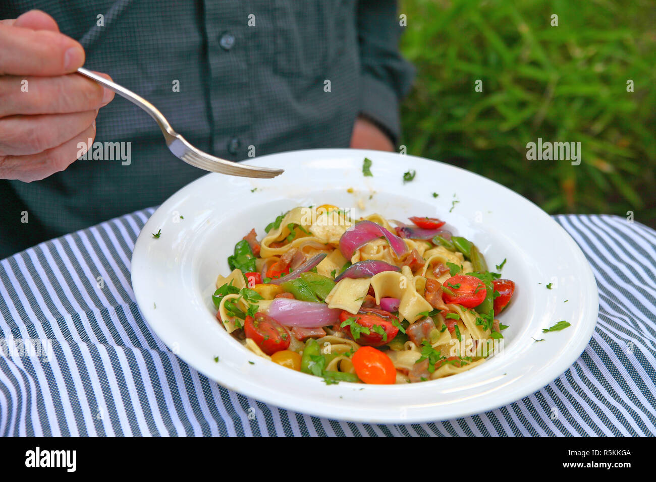 Pasta dinner outdoors Stock Photo - Alamy